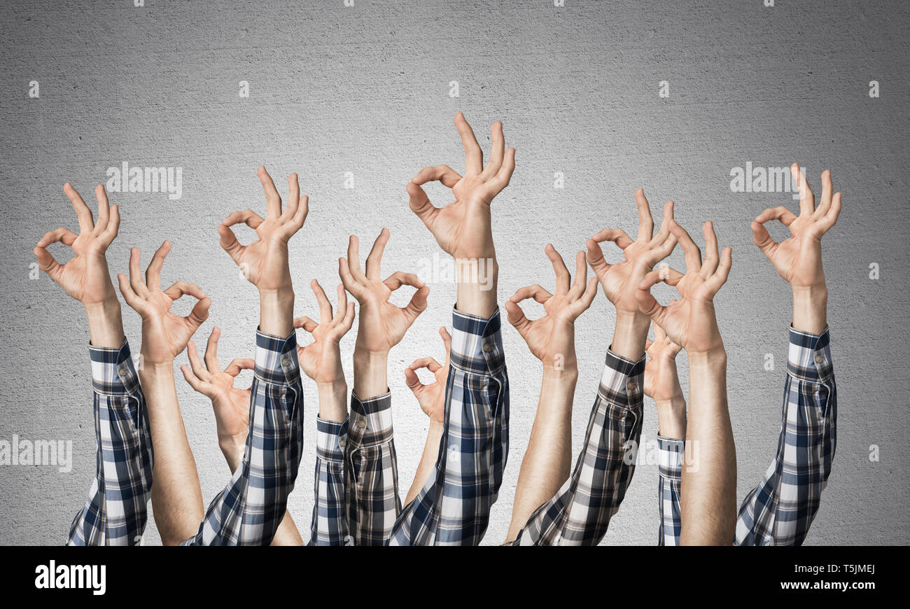 Row raised hands showing hi-res stock photography and images - Alamy