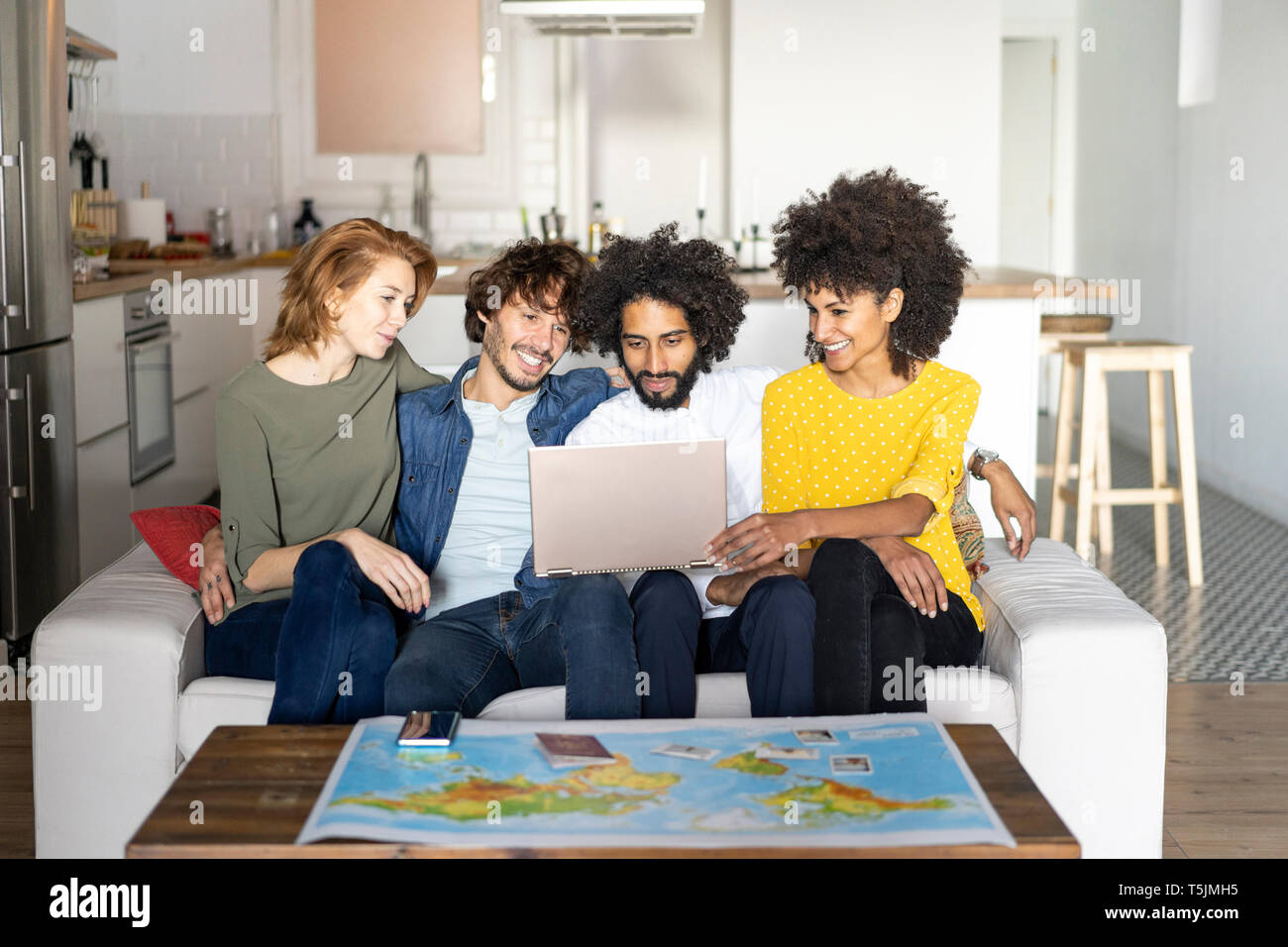 Friends meeting to plan vacations, checking map Stock Photo - Alamy