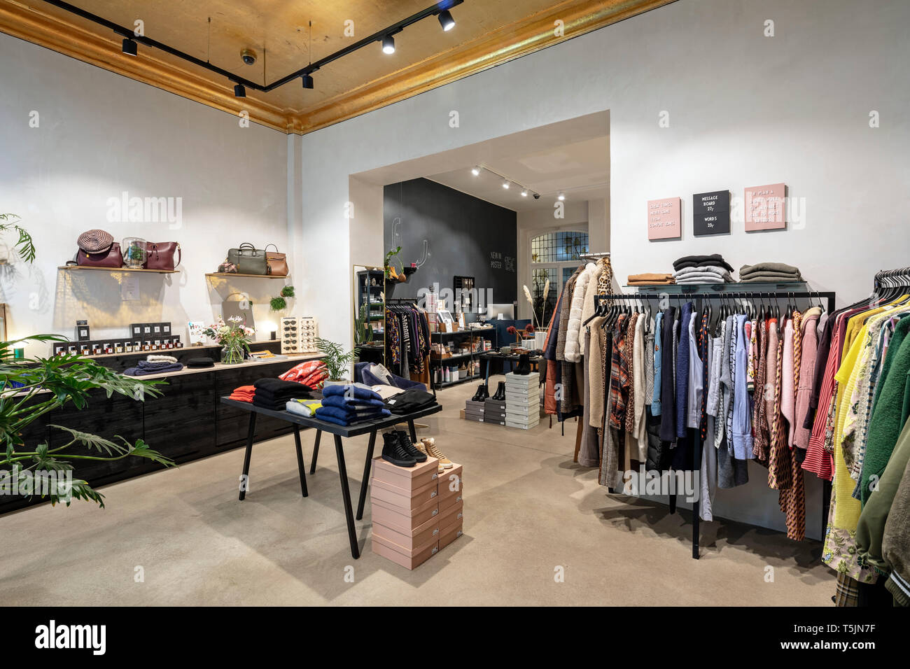 Interior of a modern concept store, displaying fashion Stock Photo - Alamy