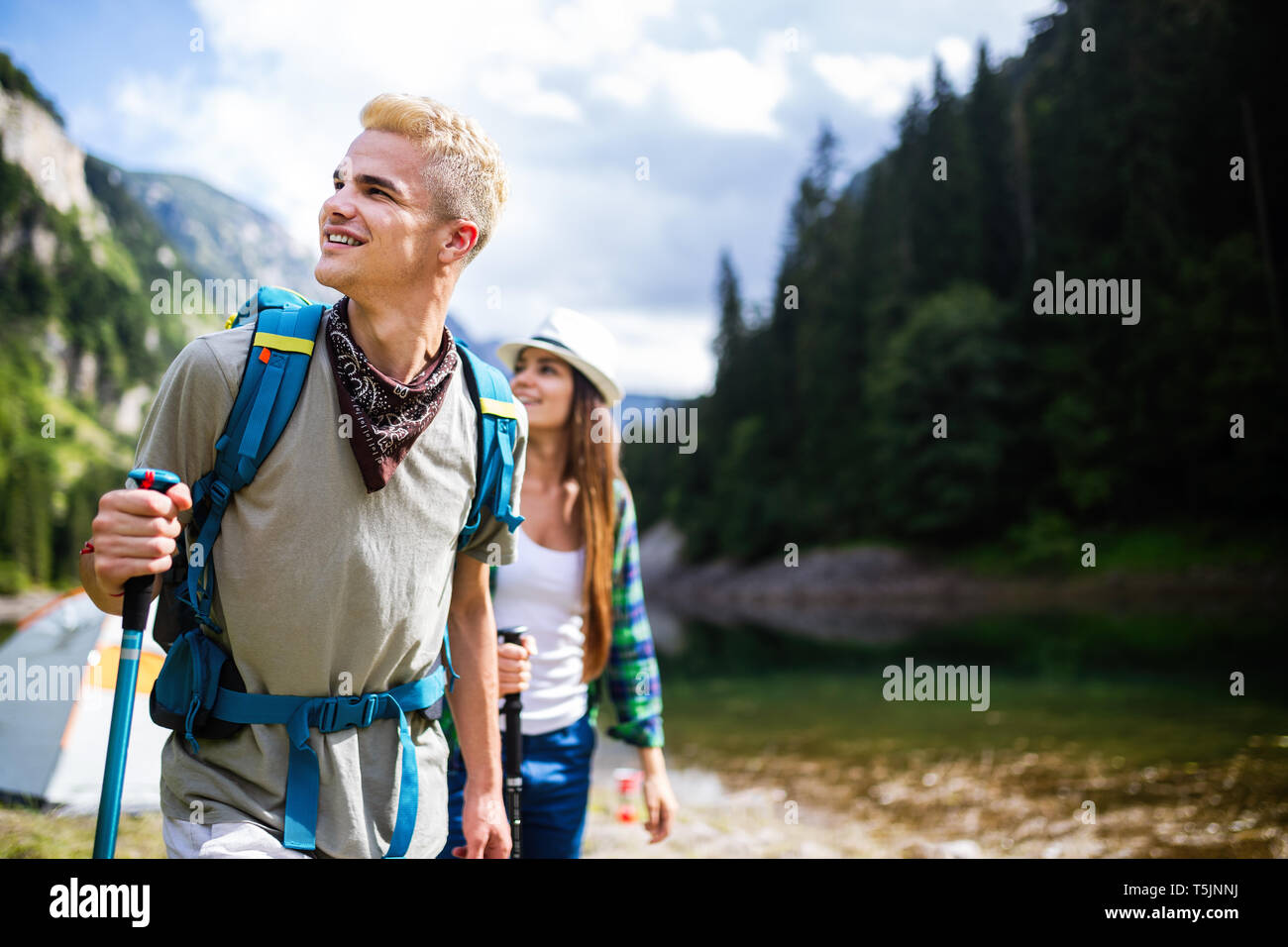 Group of happy young people friends hiking together outdoor Stock Photo ...