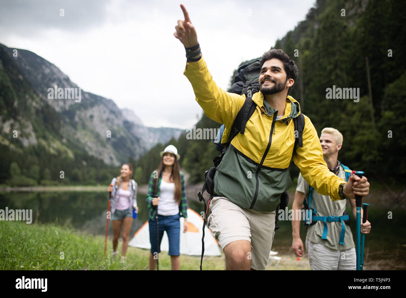 Group of happy young people friends hiking together outdoor Stock Photo ...