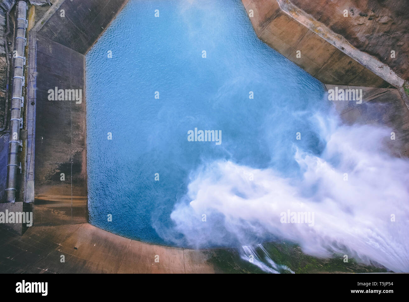 massive volume of water falling from dam gates Stock Photo - Alamy