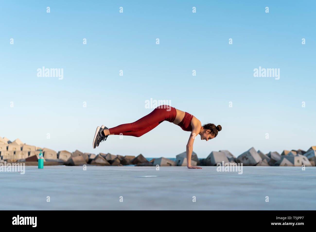 Sportive young woman during workout, moving legs Stock Photo - Alamy