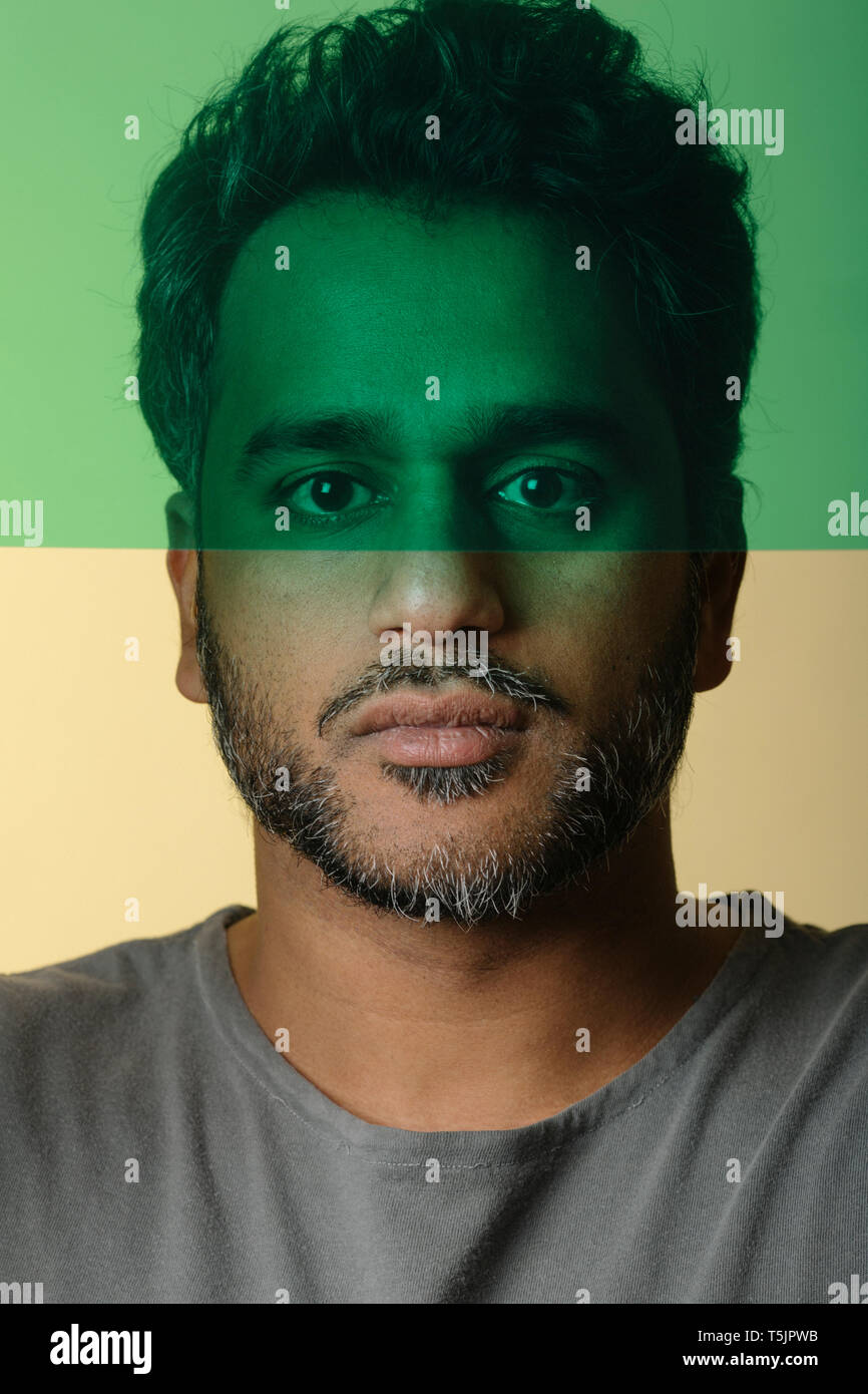Portrait of an Indian man behind green glass layers Stock Photo - Alamy