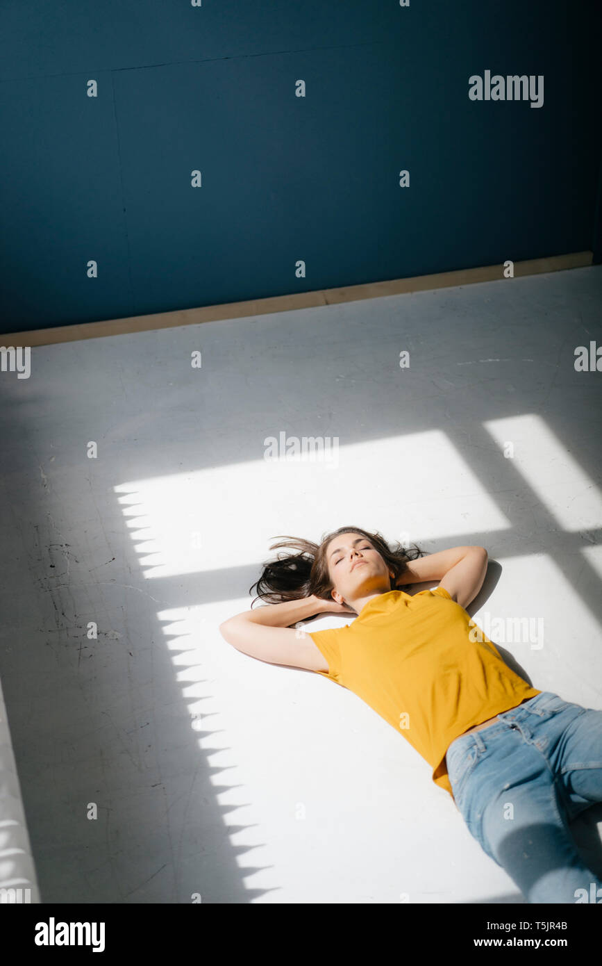 Woman lying floor hi-res stock photography and images - Alamy
