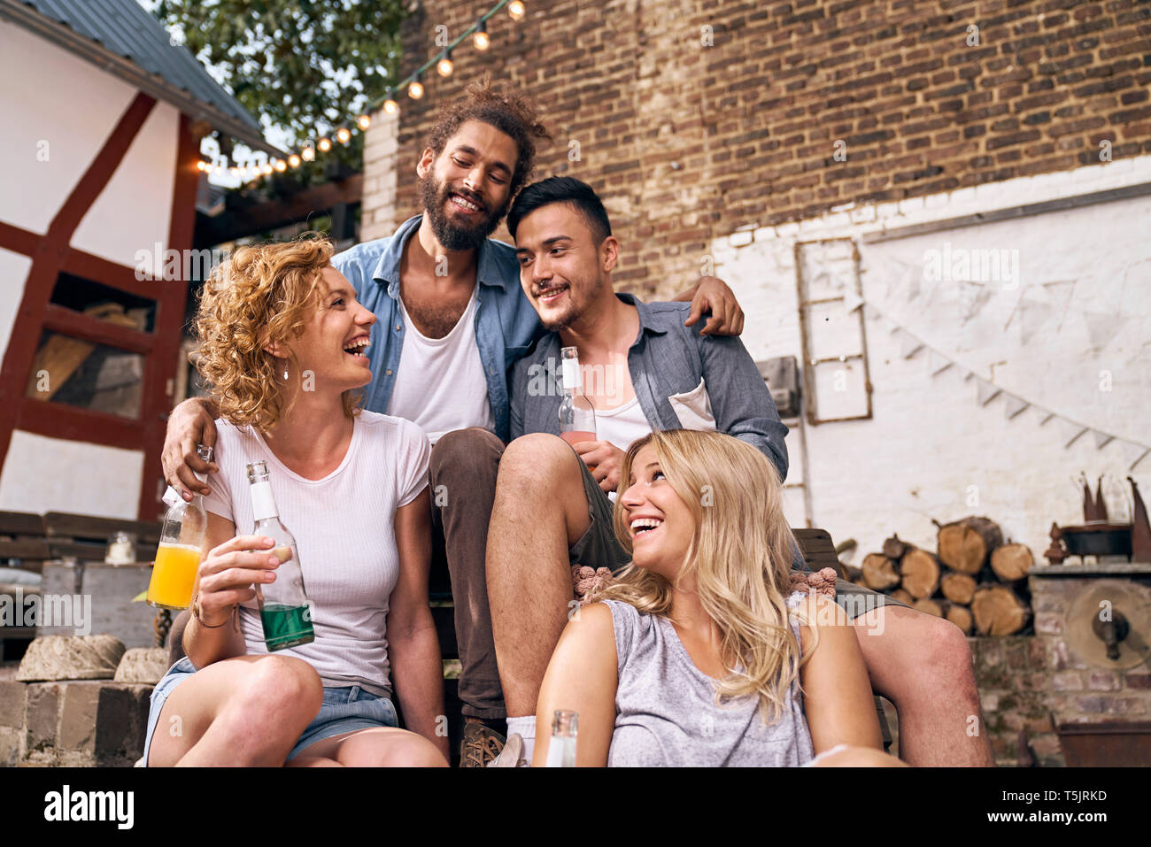 Friends having fun in a backyard in the summer Stock Photo - Alamy