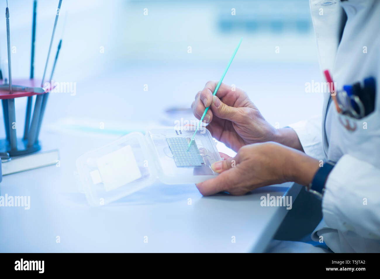 Lab technician preparing sample Stock Photo - Alamy