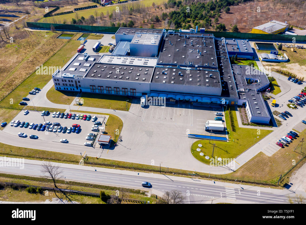 Distribution logistics building parking lot - aerial view Stock Photo ...