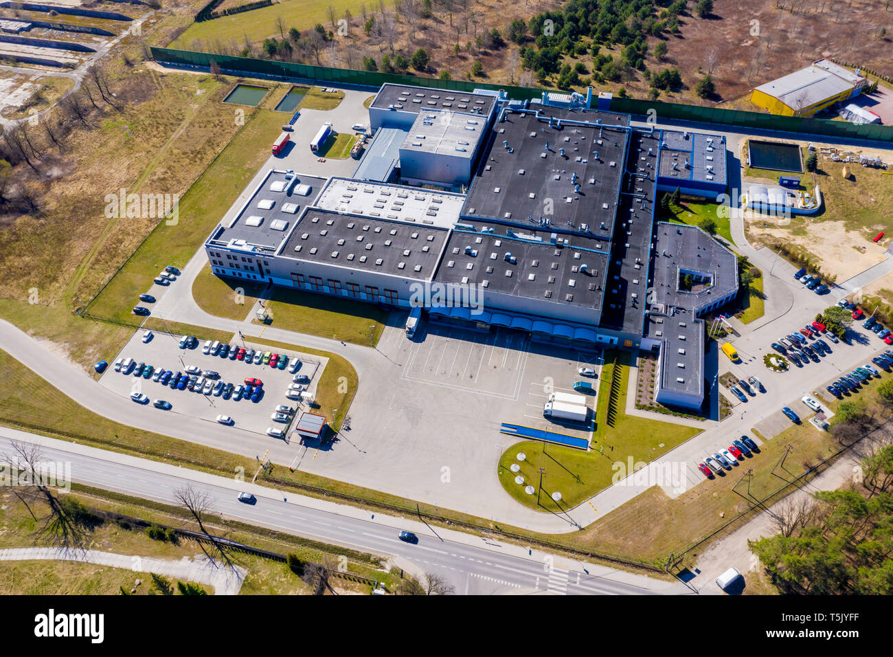 Distribution logistics building parking lot - aerial view Stock Photo ...