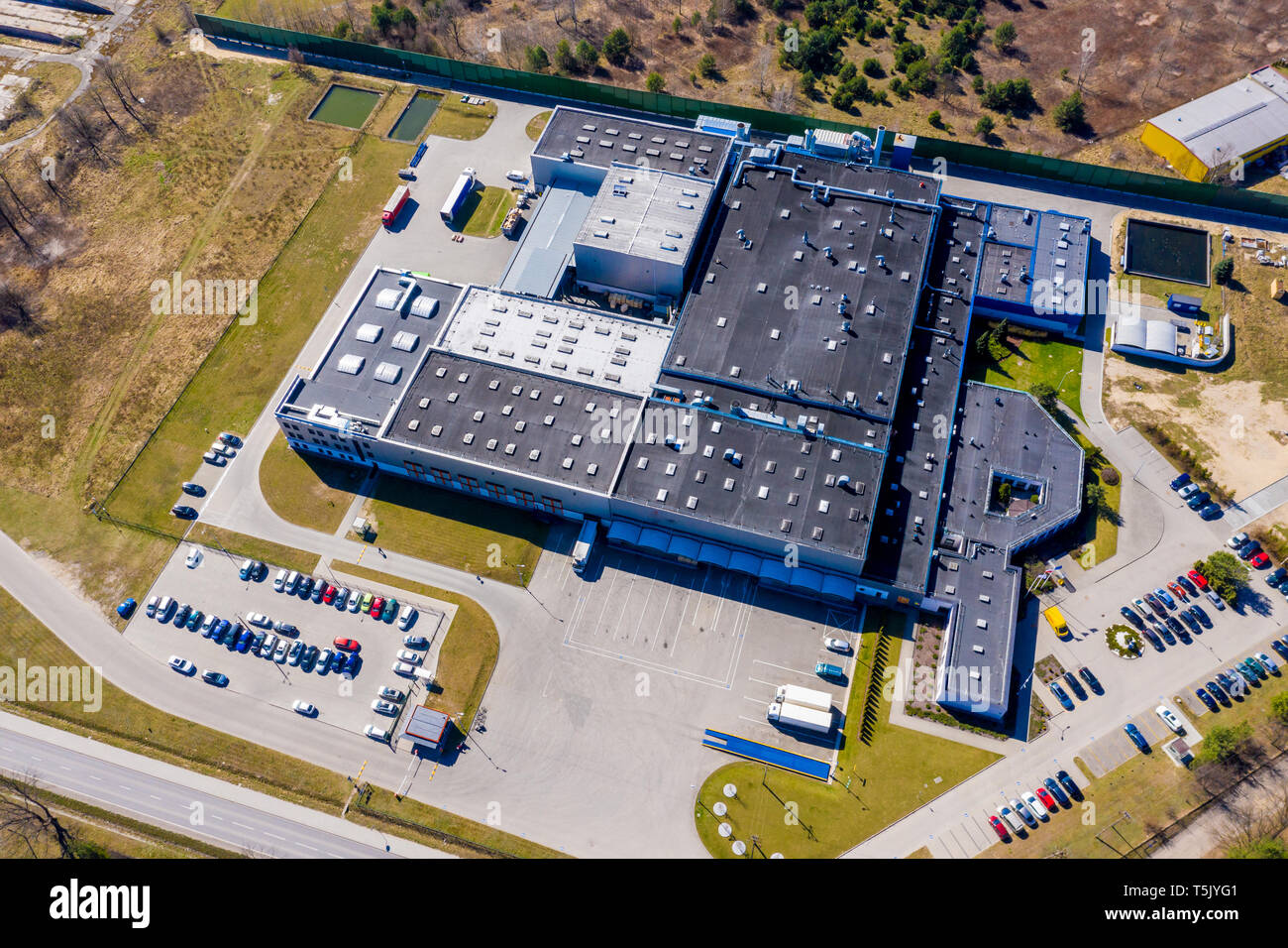 Distribution logistics building parking lot - aerial view Stock Photo ...