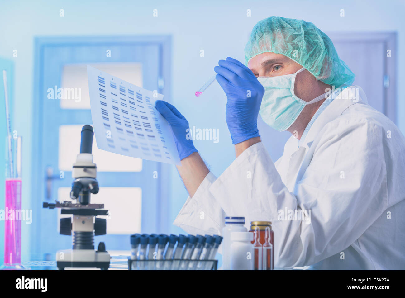 Scientist analizing DNA sequence in the modern laboratory Stock Photo ...