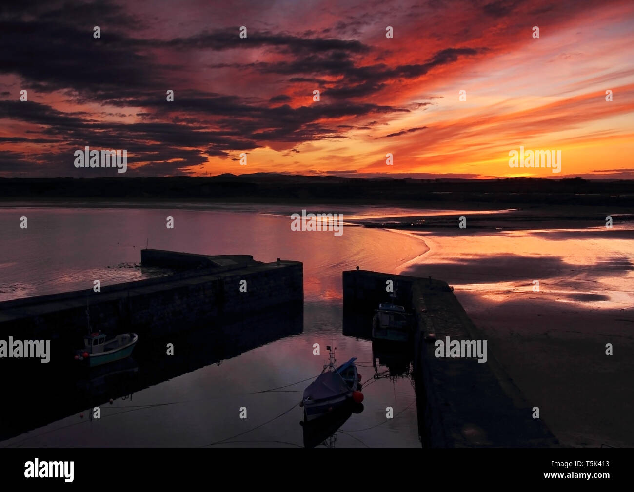 Sunset over Beadnell Harbour Stock Photo - Alamy