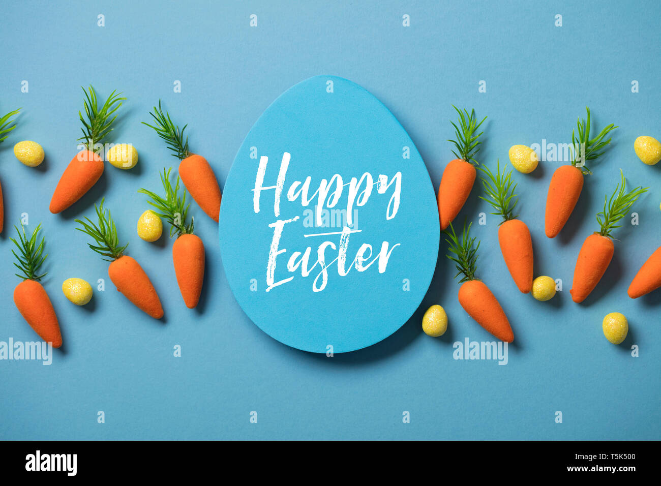 Easter festive background with easter bunny carrots and easter eggs ...