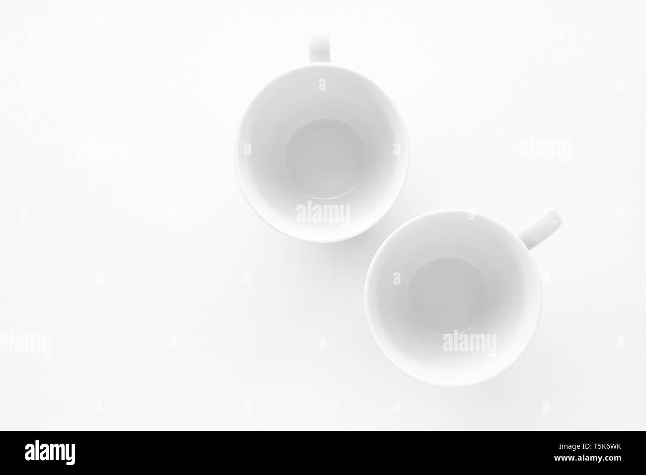Kitchen, dishware design and drink concept - Empty cup and saucer ...