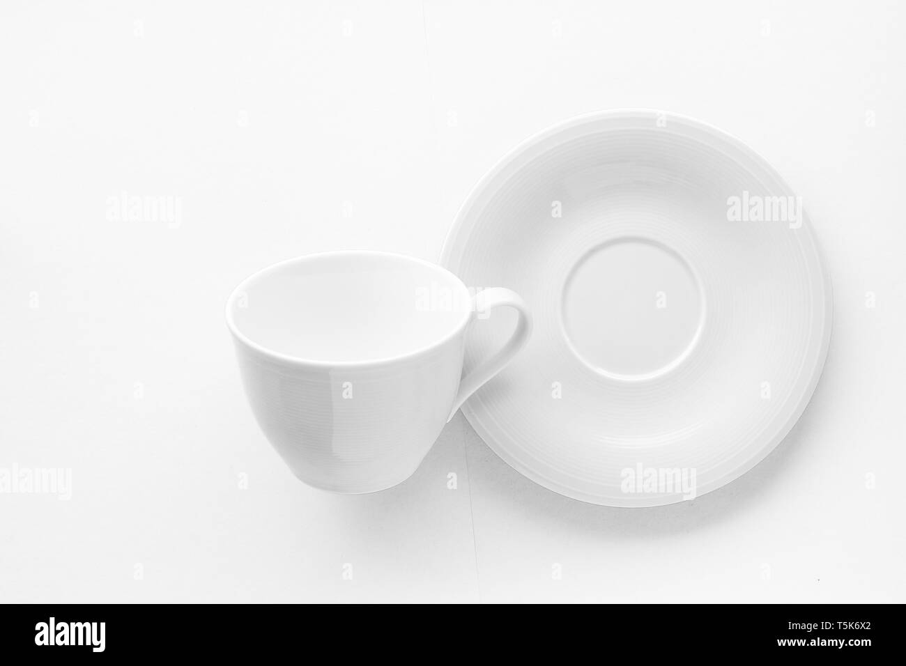 Kitchen, dishware design and drink concept - Empty cup and saucer ...