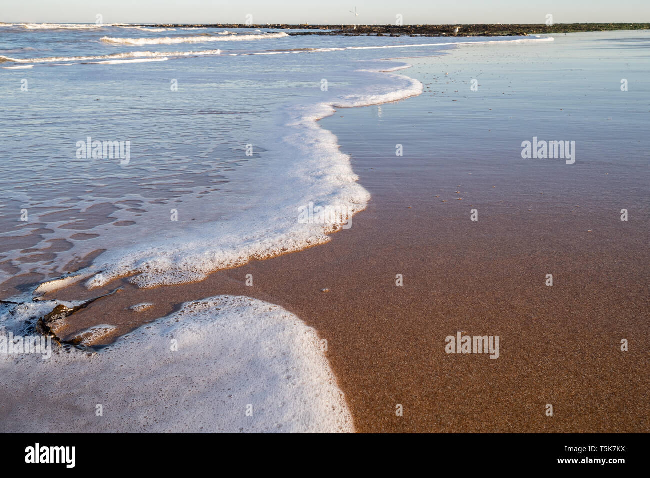 Water washing up on beach hi-res stock photography and images - Alamy