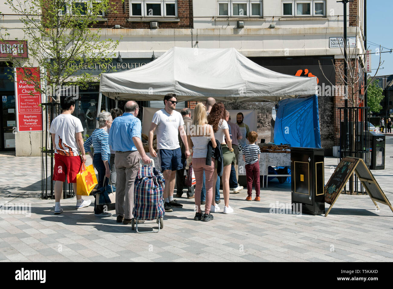 People queuing to buy bread in front of Celtic Bakers stall on ...