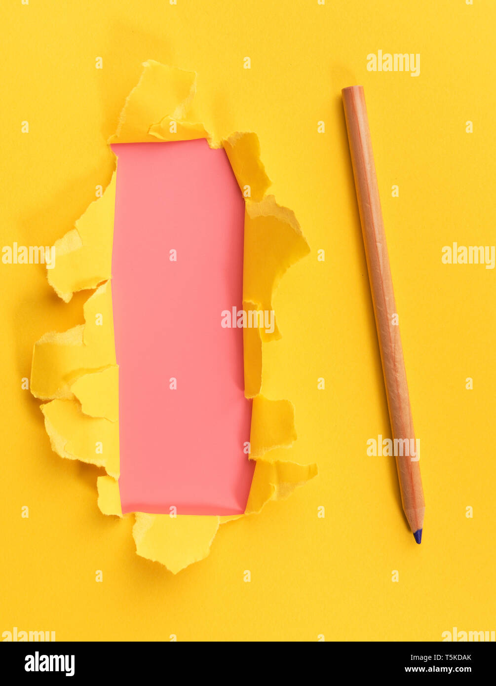 Yellow torned paper over pink background with pencil Stock Photo - Alamy