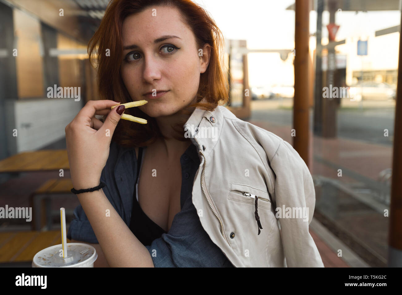 Fri potatoes close up face - Eating and enjoying - Young Woman eating ...
