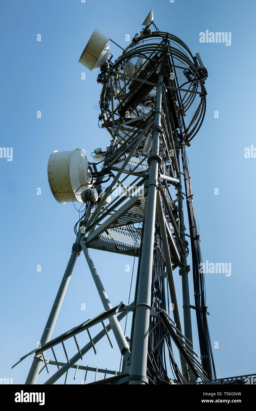relay antenna on blue sky background Stock Photo - Alamy