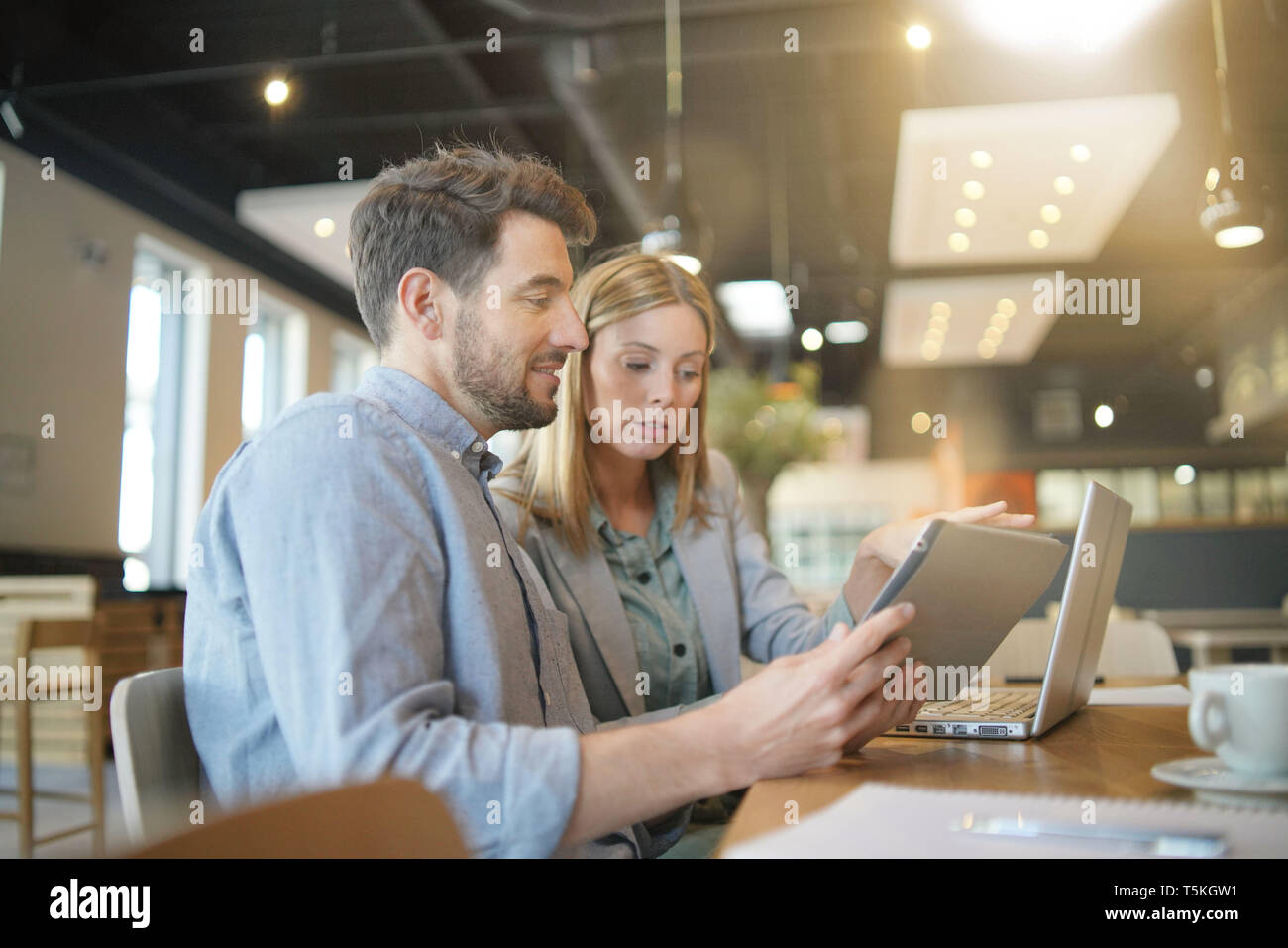 Sales colleagues prepping before meeting Stock Photo - Alamy