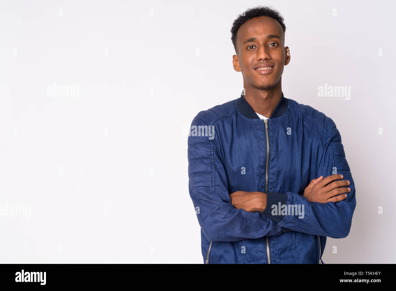 Portrait of young happy African man smiling with arms crossed Stock ...