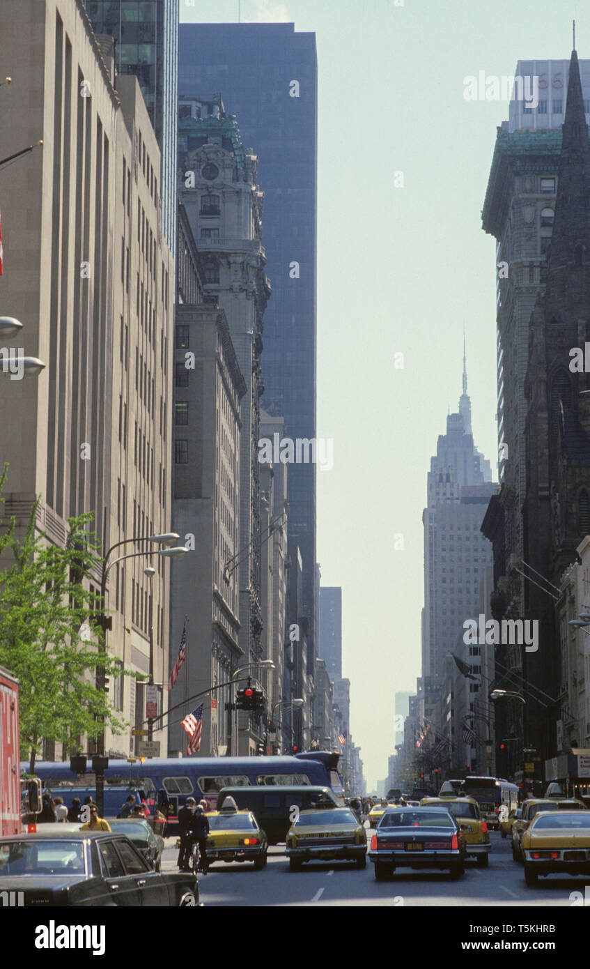 MANHATTAN New York USA traffic on avenue between tall buildings Stock ...