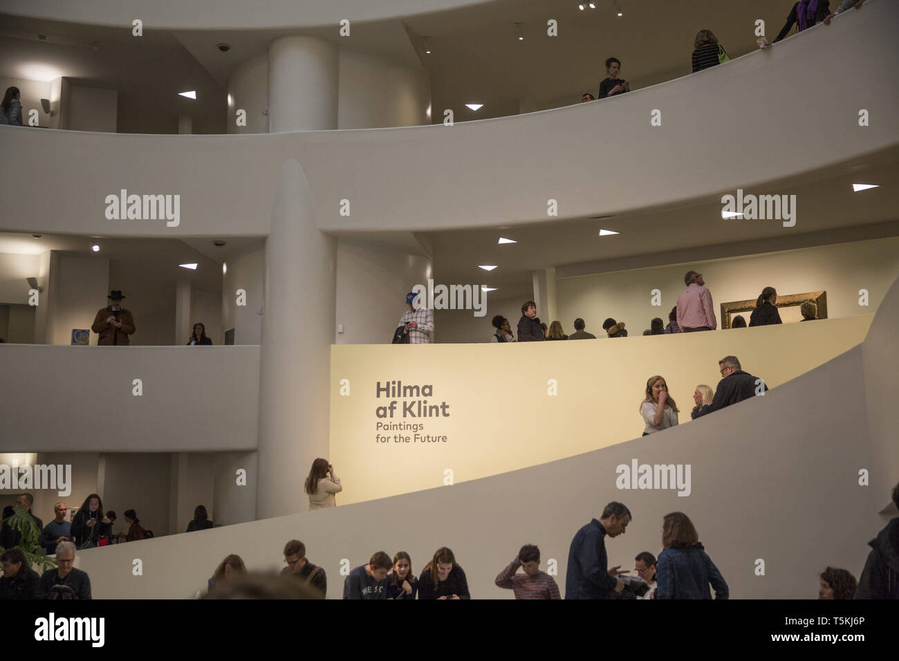 Museum goers at the Guggenheim Museum in New York City view the Hilma ...