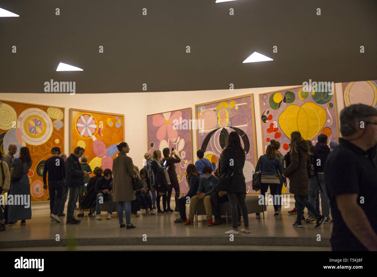 Museum goers at the Guggenheim Museum in New York City view the Hilma ...