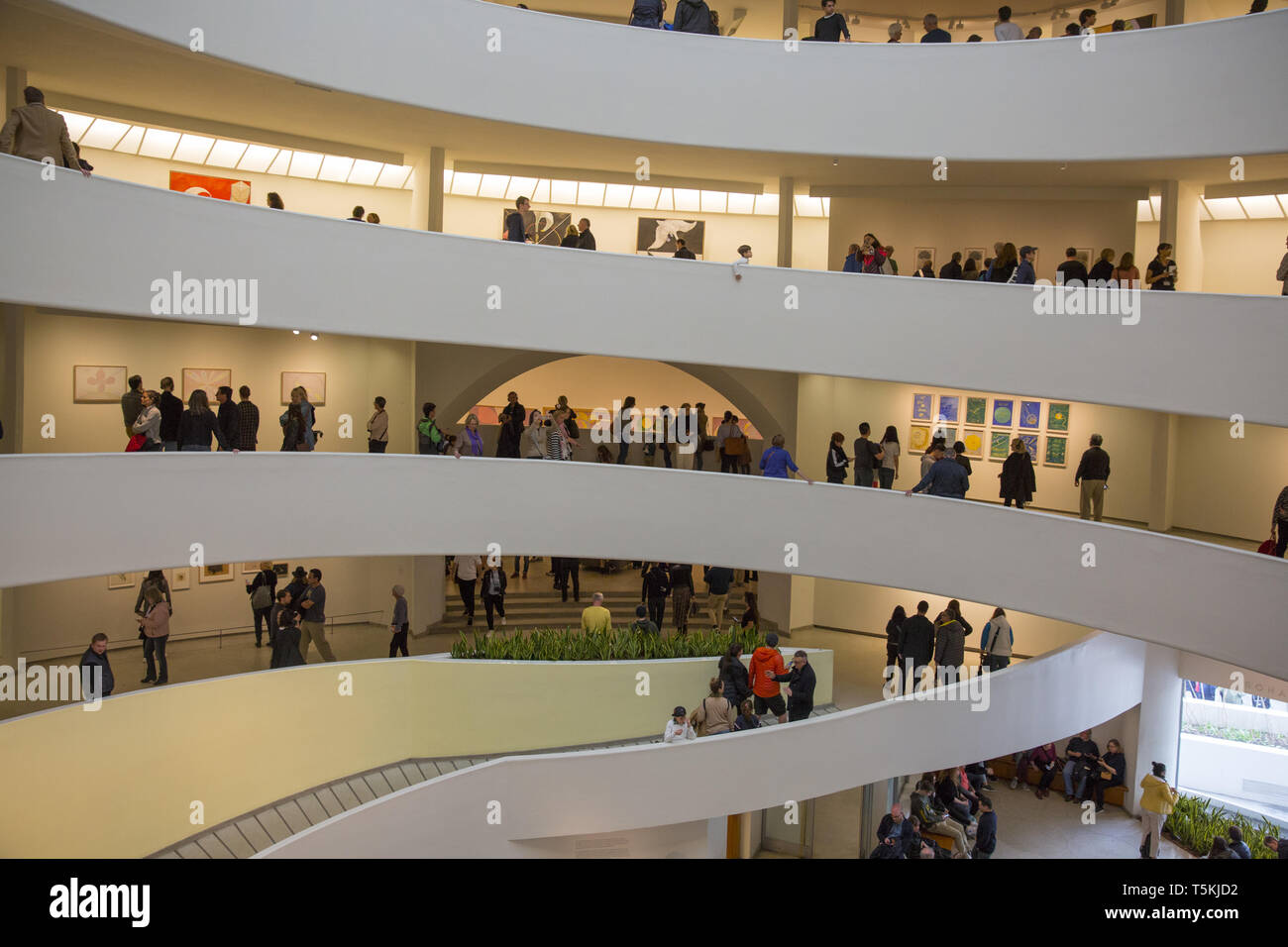 Museum goers at the Guggenheim Museum in New York City view the Hilma ...