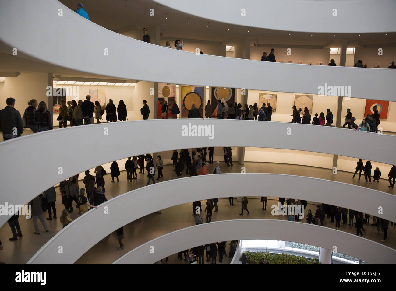 Museum goers at the Guggenheim Museum in New York City view the Hilma ...
