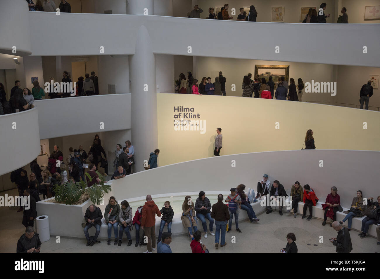 Museum goers at the Guggenheim Museum in New York City view the Hilma ...