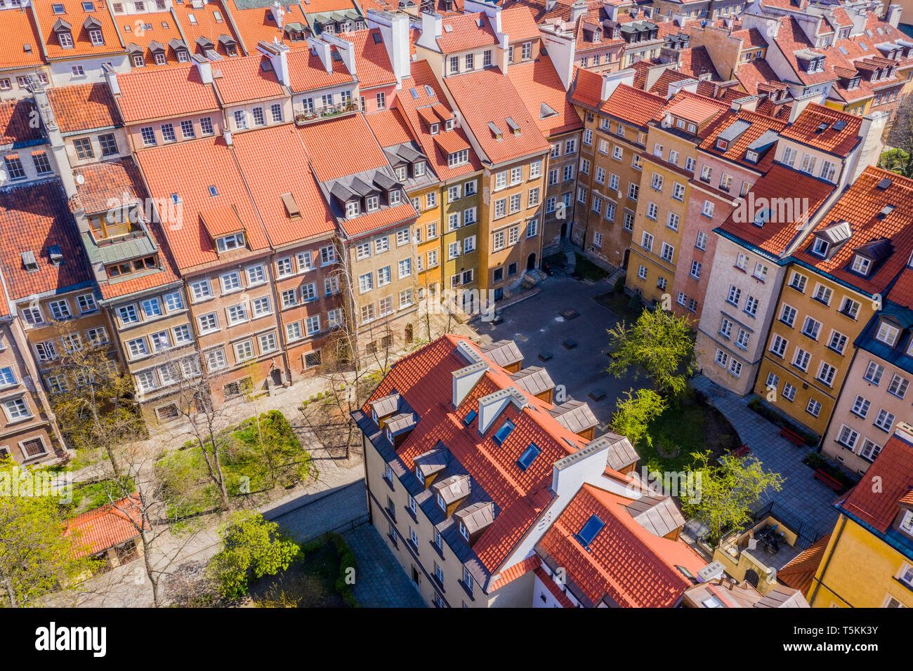 Warsaw, Poland red orange roof in old town market square with historic ...