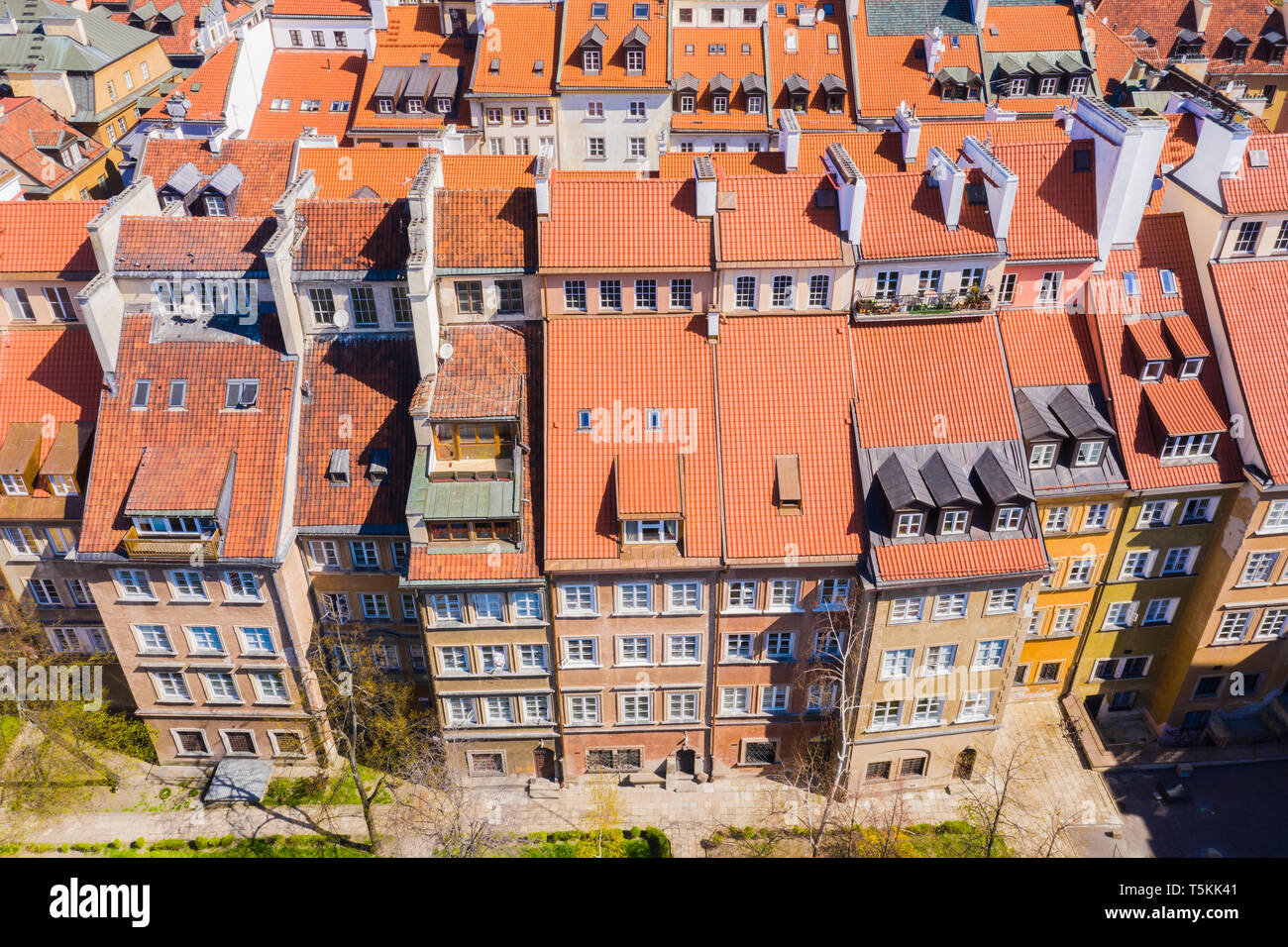 Warsaw, Poland red orange roof in old town market square with historic ...