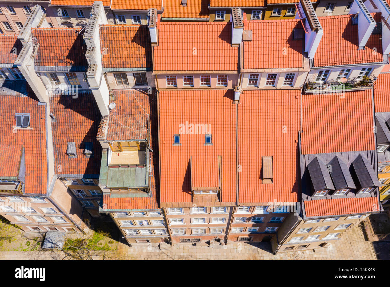 Warsaw, Poland red orange roof in old town market square with historic ...