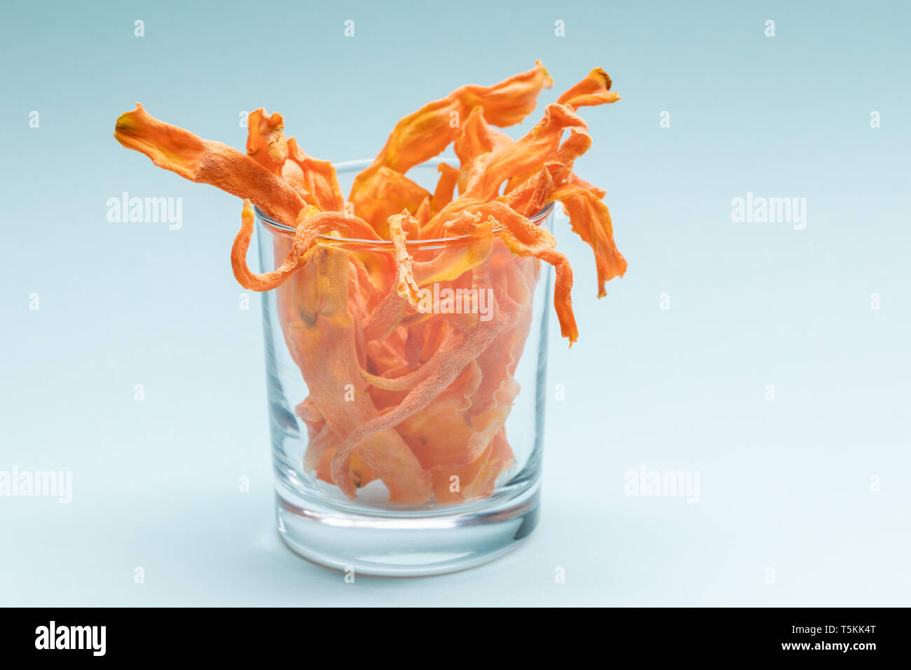 Close-up transparent glass with homemade healthy longitudinal carrot ...