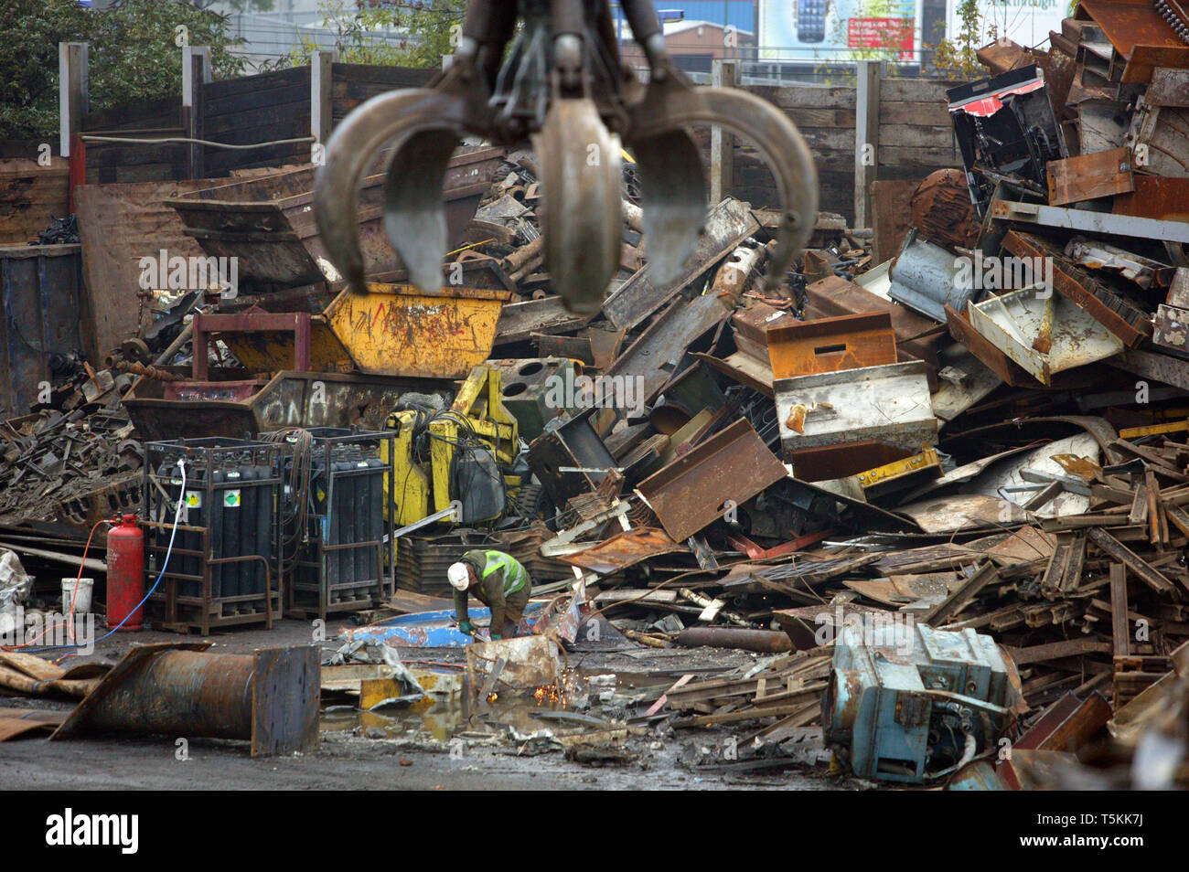 Recycling metal and waste materials at a scrap yard in North London. 3 ...