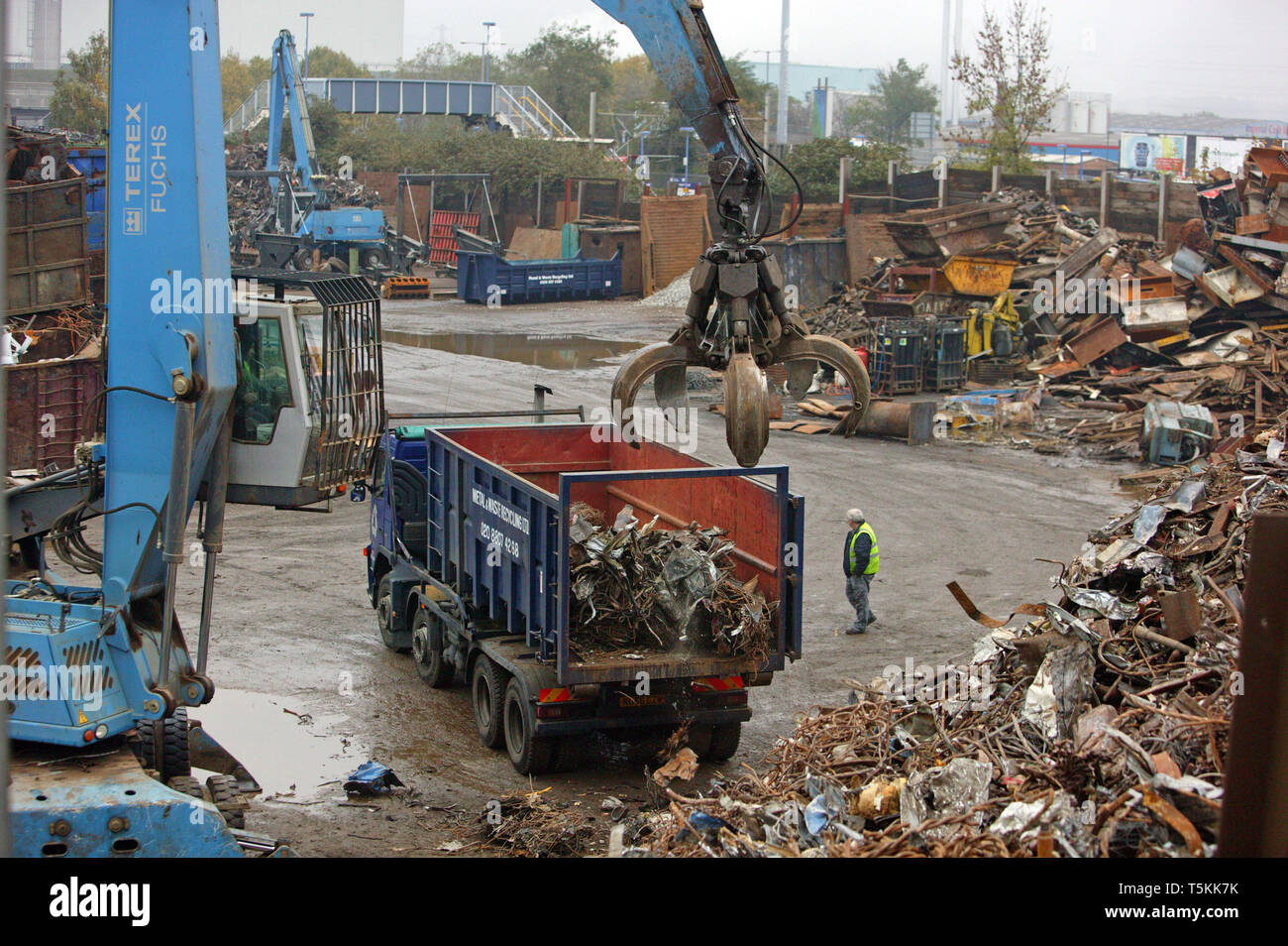 Recycling metal and waste materials at a scrap yard in North London. 3 ...