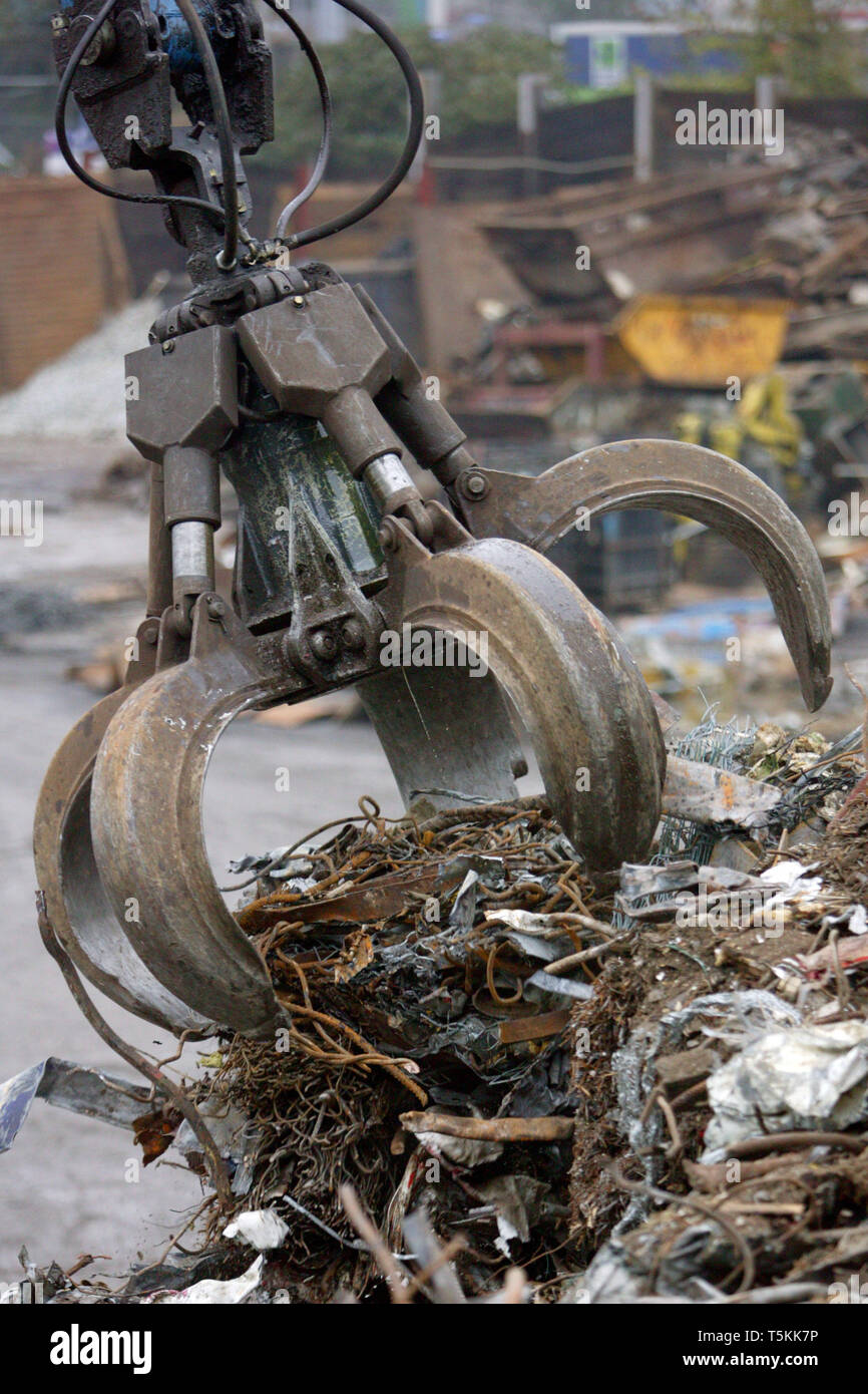 Recycling metal and waste materials at a scrap yard in North London. 3 ...