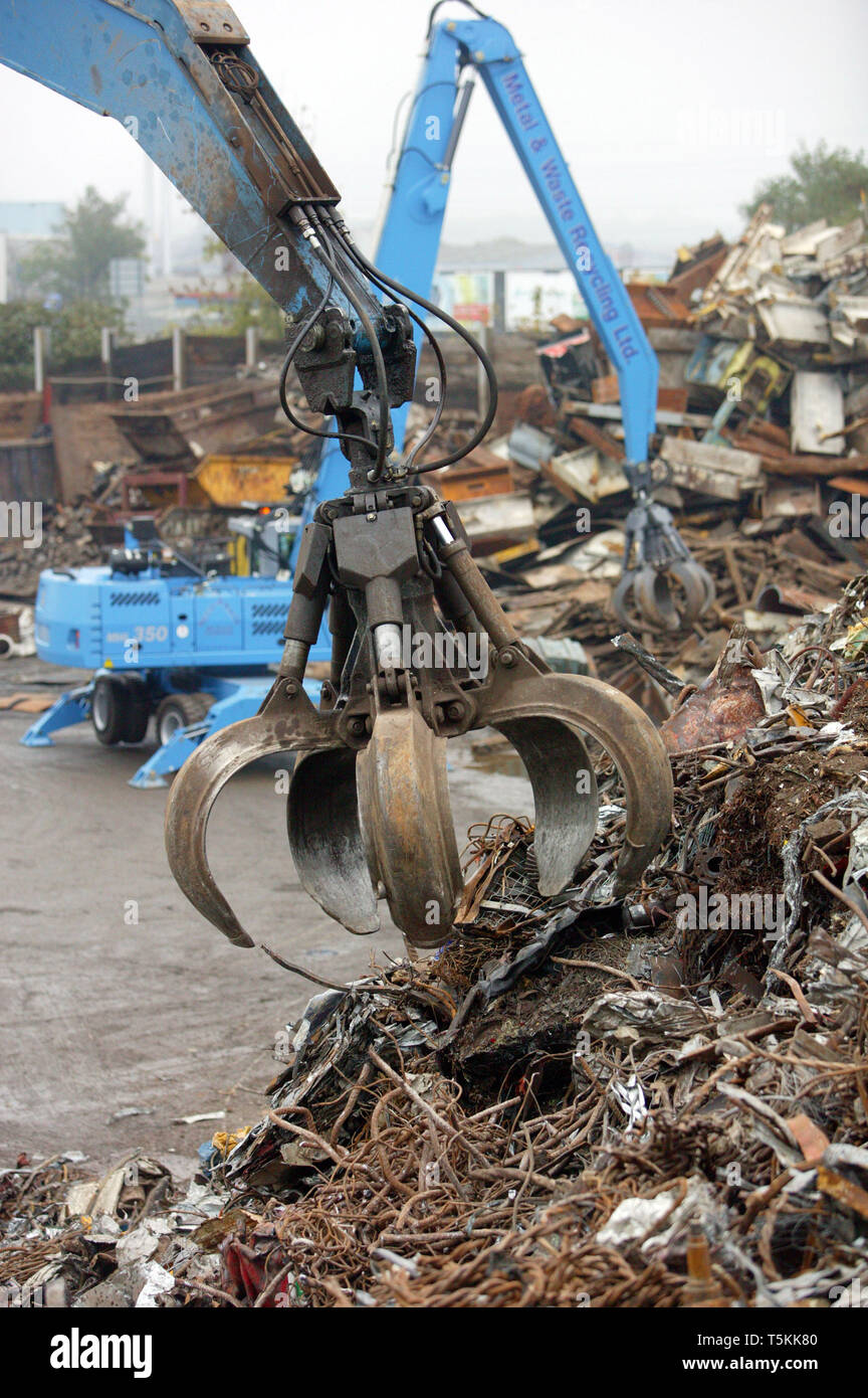 Recycling metal and waste materials at a scrap yard in North London. 3 ...