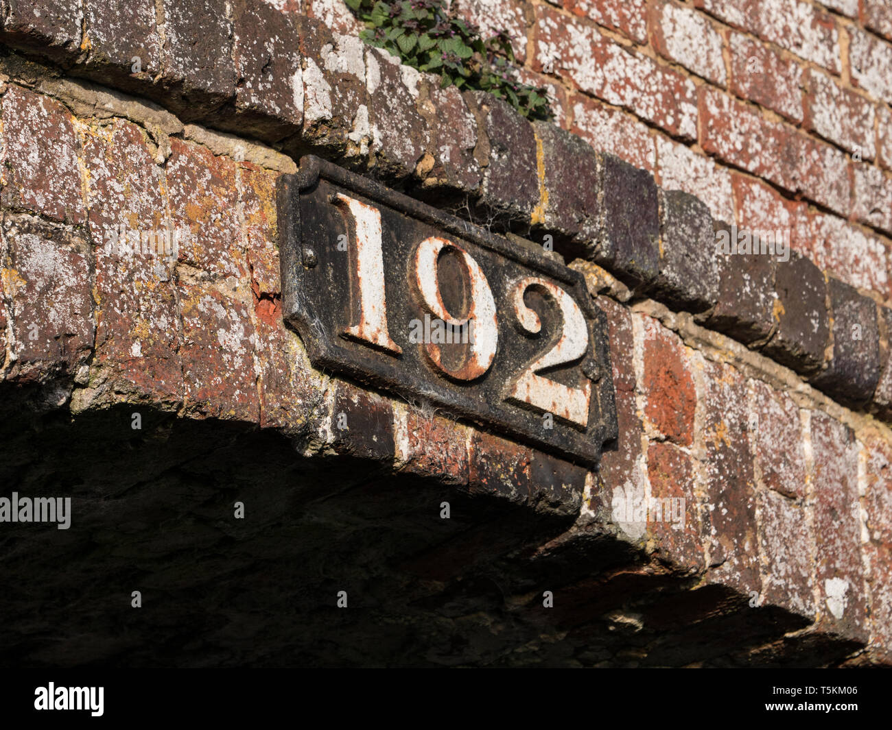 Number 192 sign set on brickwork Stock Photo - Alamy