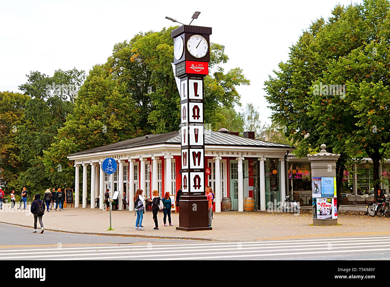 RIGA, LATVIA - AUGUST 28, 2018: People are walking near the Laima clock ...