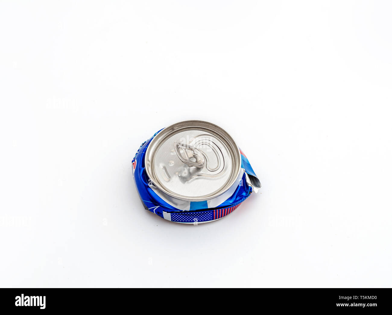 Crushed compressed aluminum carbonated drink can. Pollution, waste ...