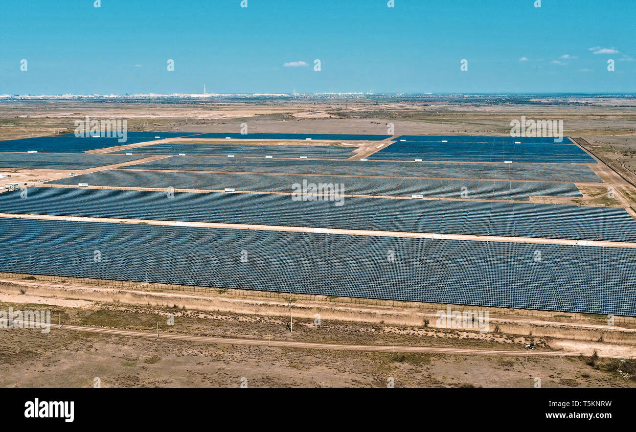 Aerial view of solar power plant. Photovoltaic power station supplying ...