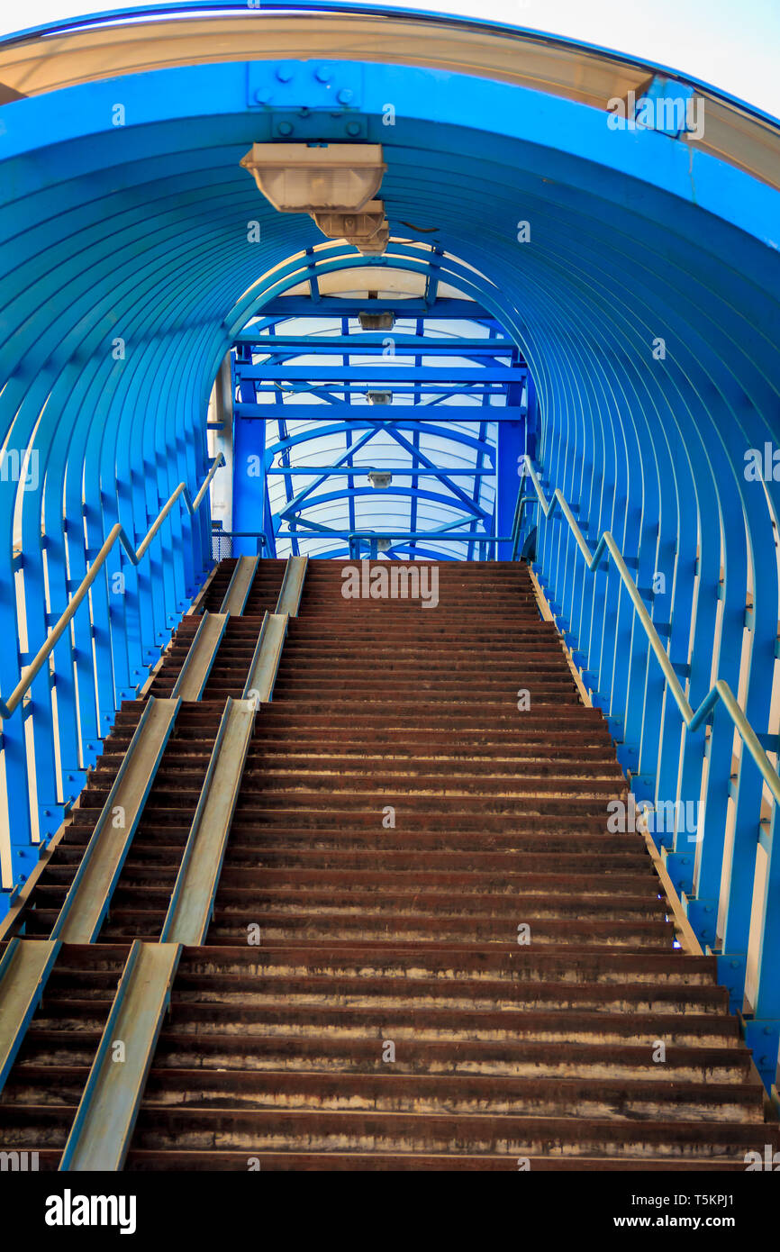 Pedestrian bridge over the highway. Safe crossing over the road. Steps ...