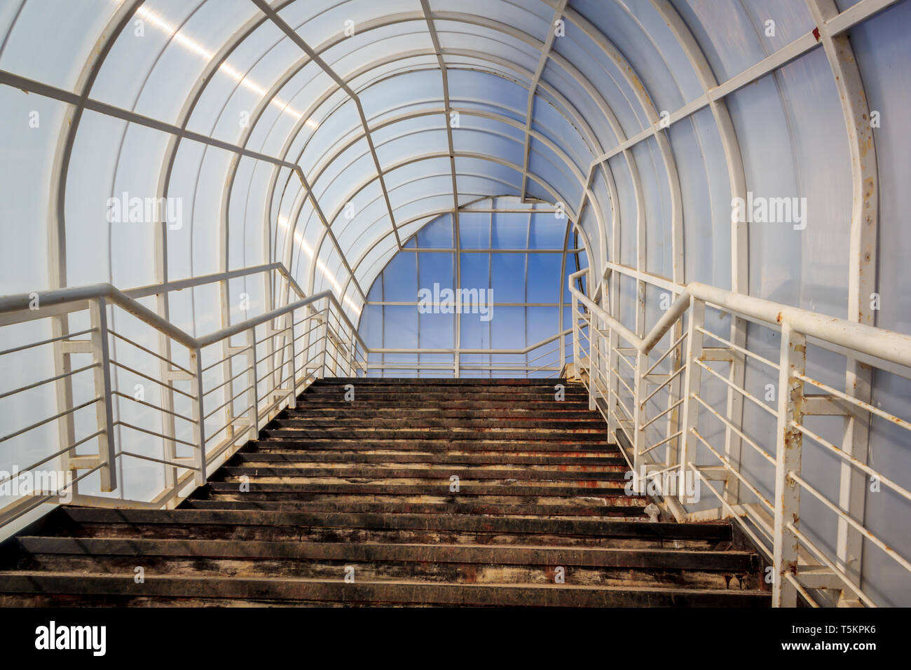 Pedestrian bridge over the highway. Safe crossing over the road. Steps ...