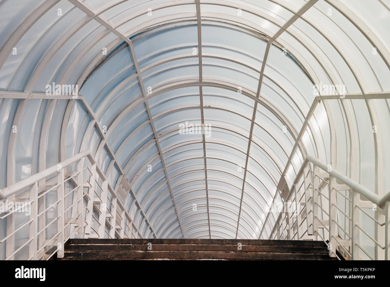 Pedestrian bridge over the highway. Safe crossing over the road. Steps ...