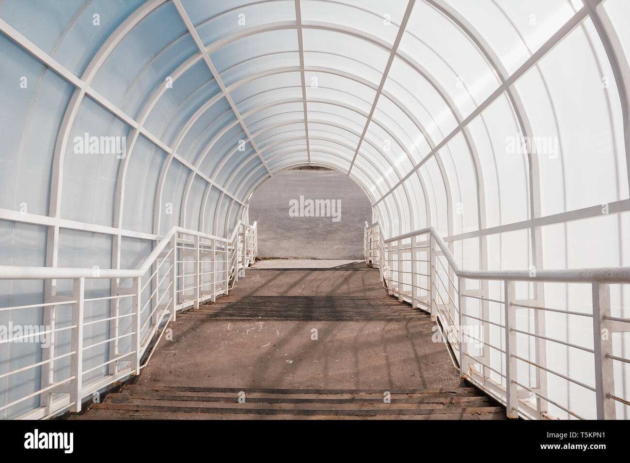 Pedestrian bridge over the highway. Safe crossing over the road. Steps ...