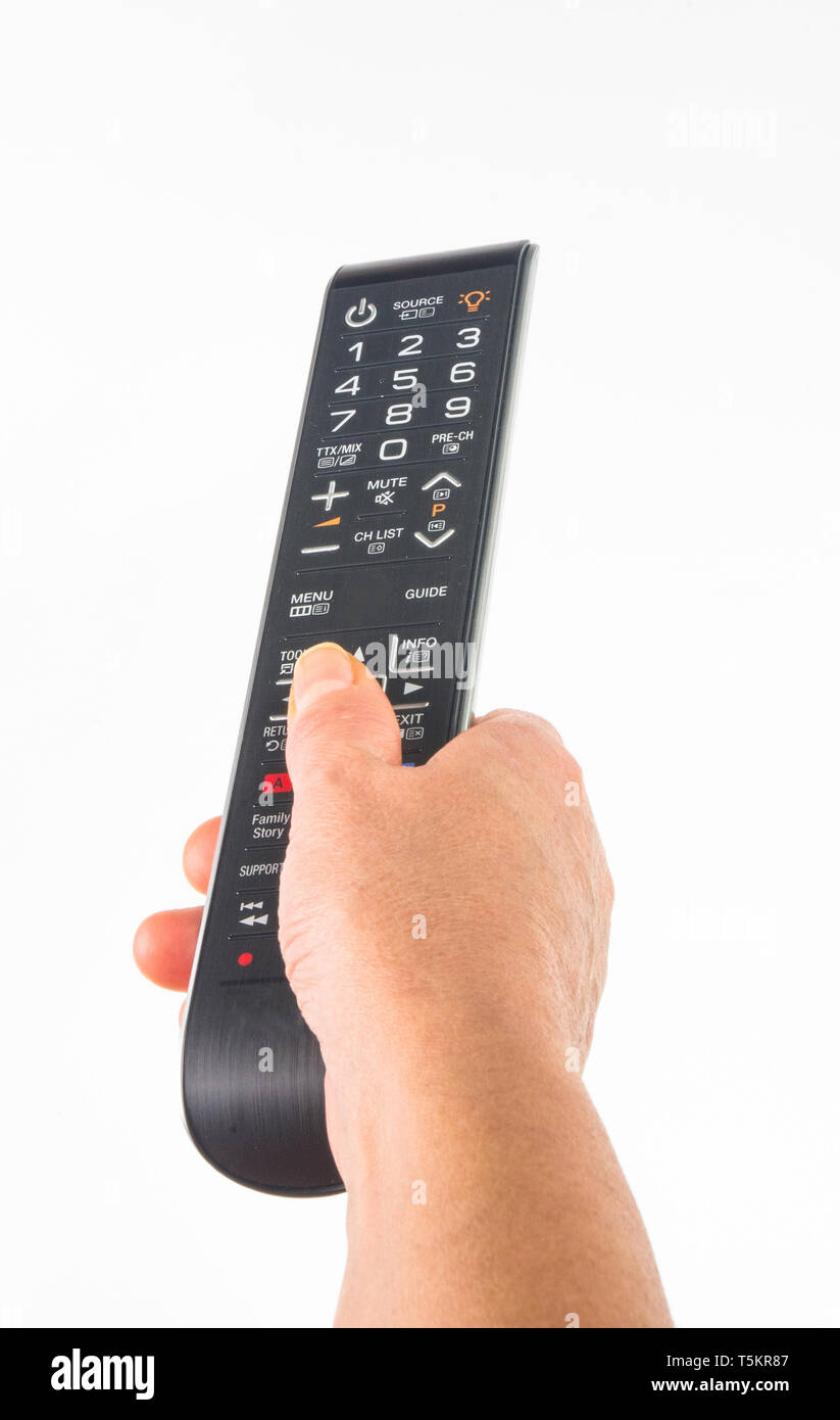 hand holding a remote control on white background Stock Photo - Alamy