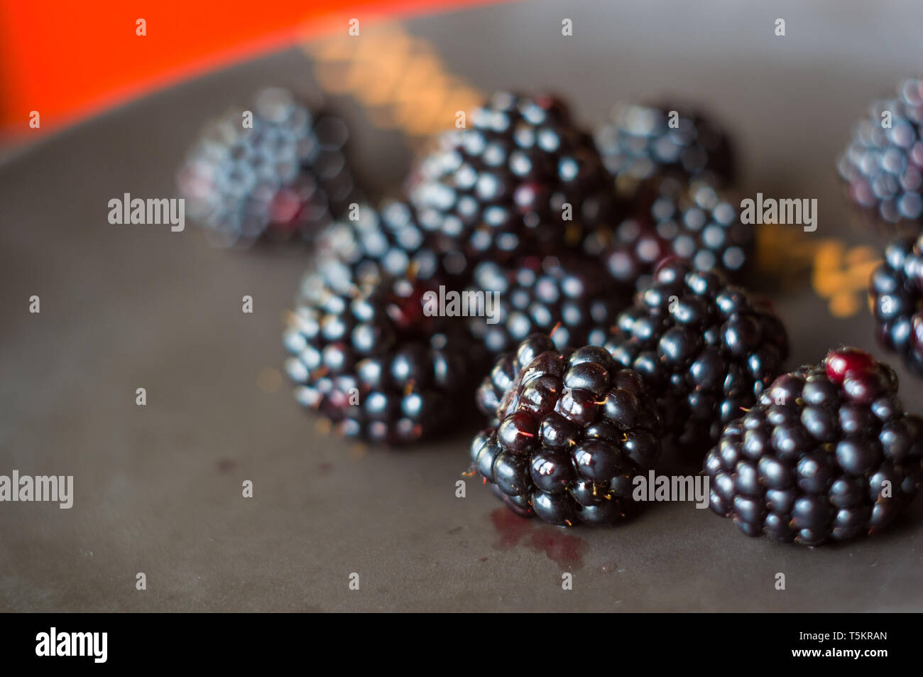 large juicy fresh blackberry berries on a ceramic plate, close-up Stock ...